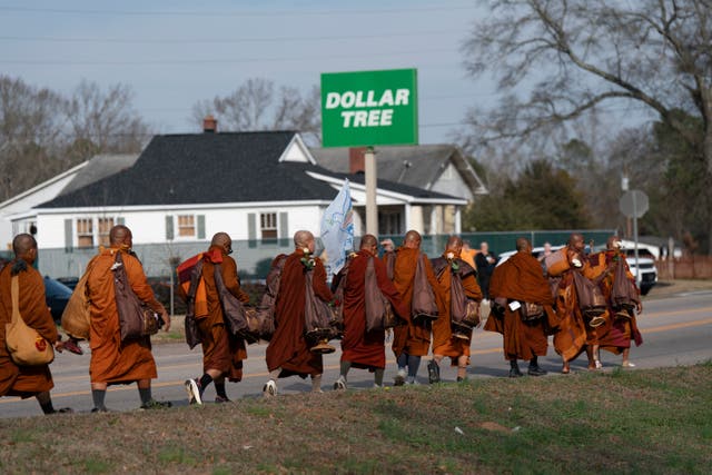 The Buddhist monks – and their dog – captivating Americans while ...