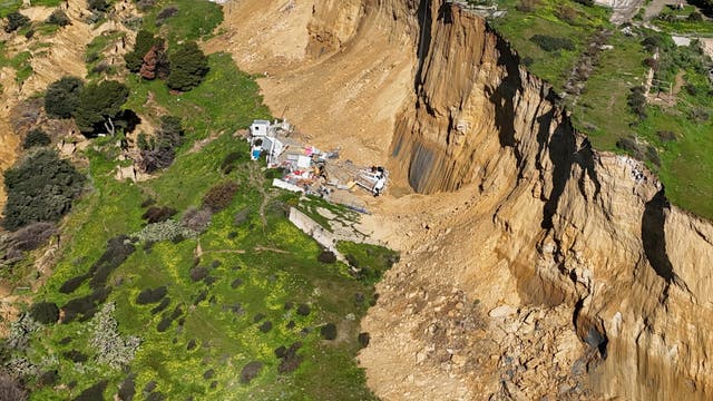Storm Harry: Homes hanging onto cliff edge following huge landslide ...