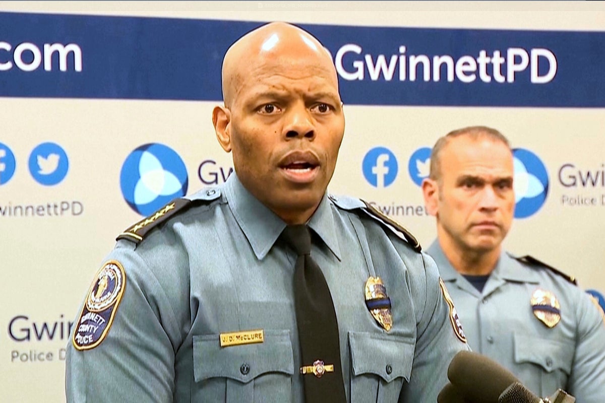 Police officer killed, another seriously wounded in hotel room shootout ...