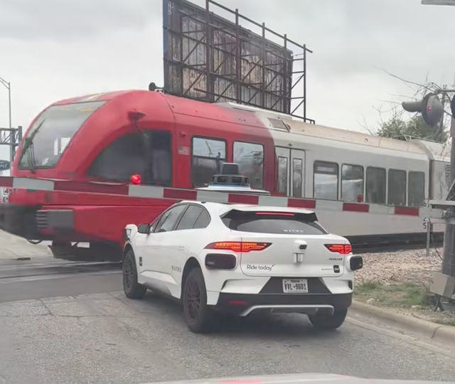 Terrifying moment Waymo stops between railway tracks and stop arm as ...