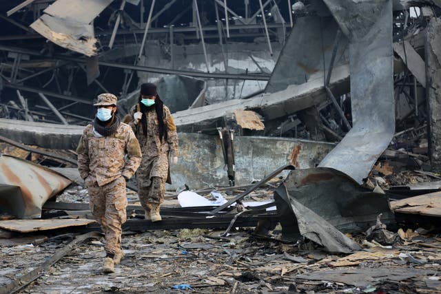 Rescue crews race through rubble after a deadly Kabul airstrike, in ...