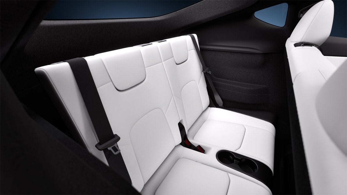 Tesla adds seven-seat Model Y with 372-mile range and £54,490 price tag ...