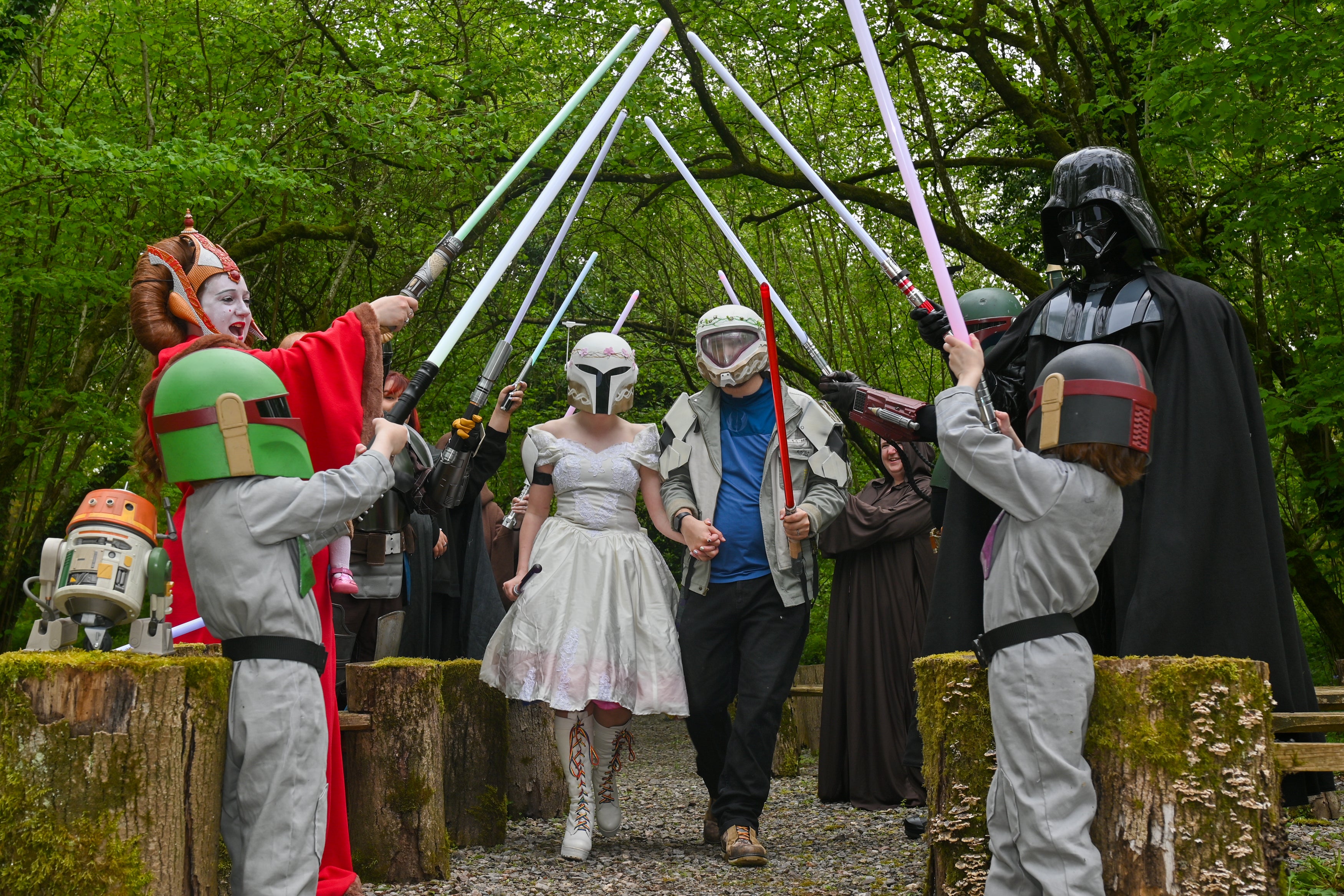 Star Wars fans marry on May the Fourth with lightsabers and droid ...