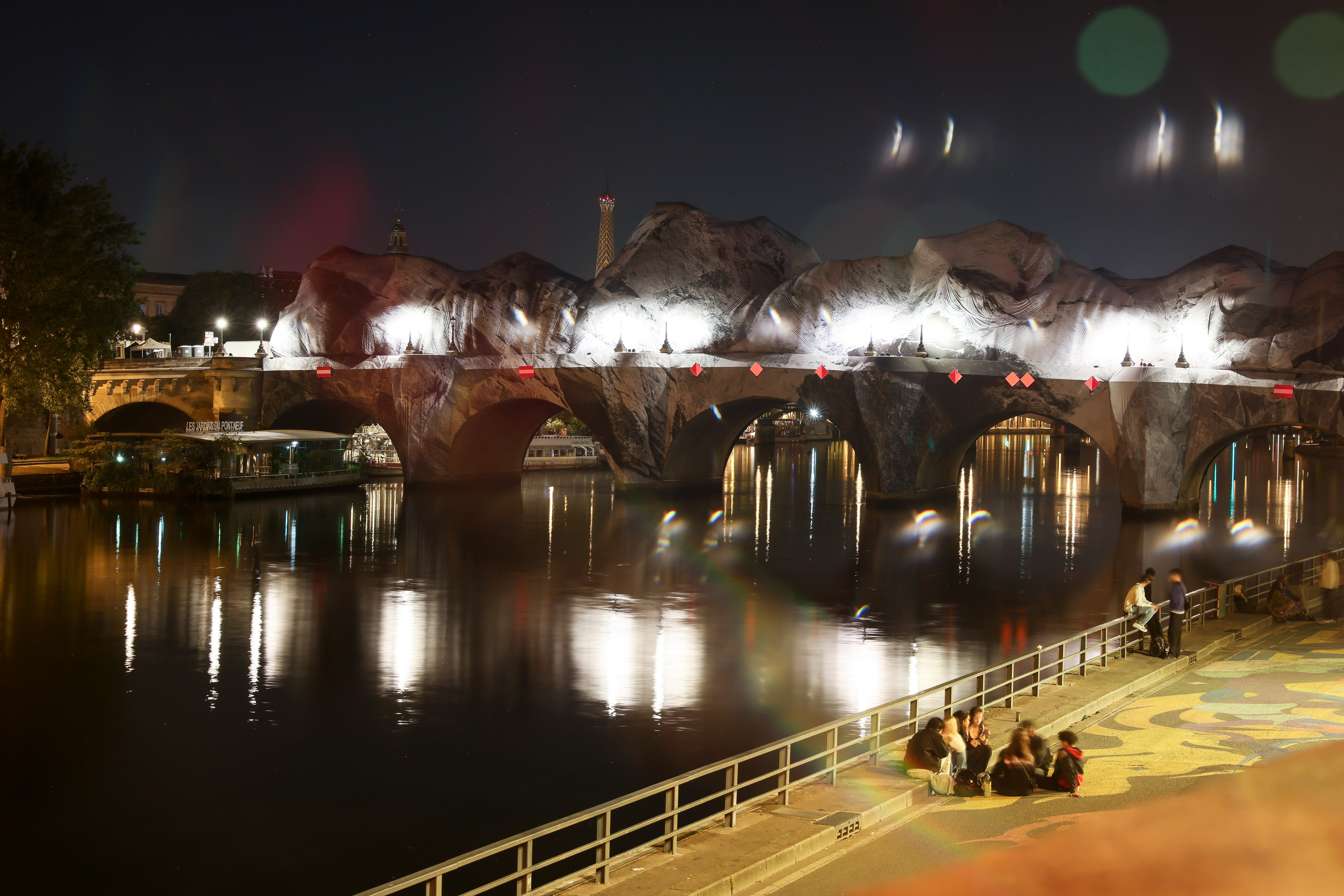 Giant ‘cave’ art inflated over Paris’ oldest bridge in latest work by ...