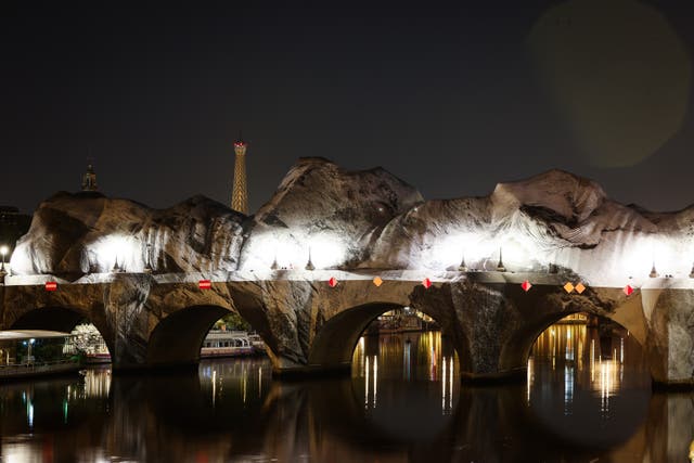 Giant ‘cave’ art inflated over Paris’ oldest bridge in latest work by ...