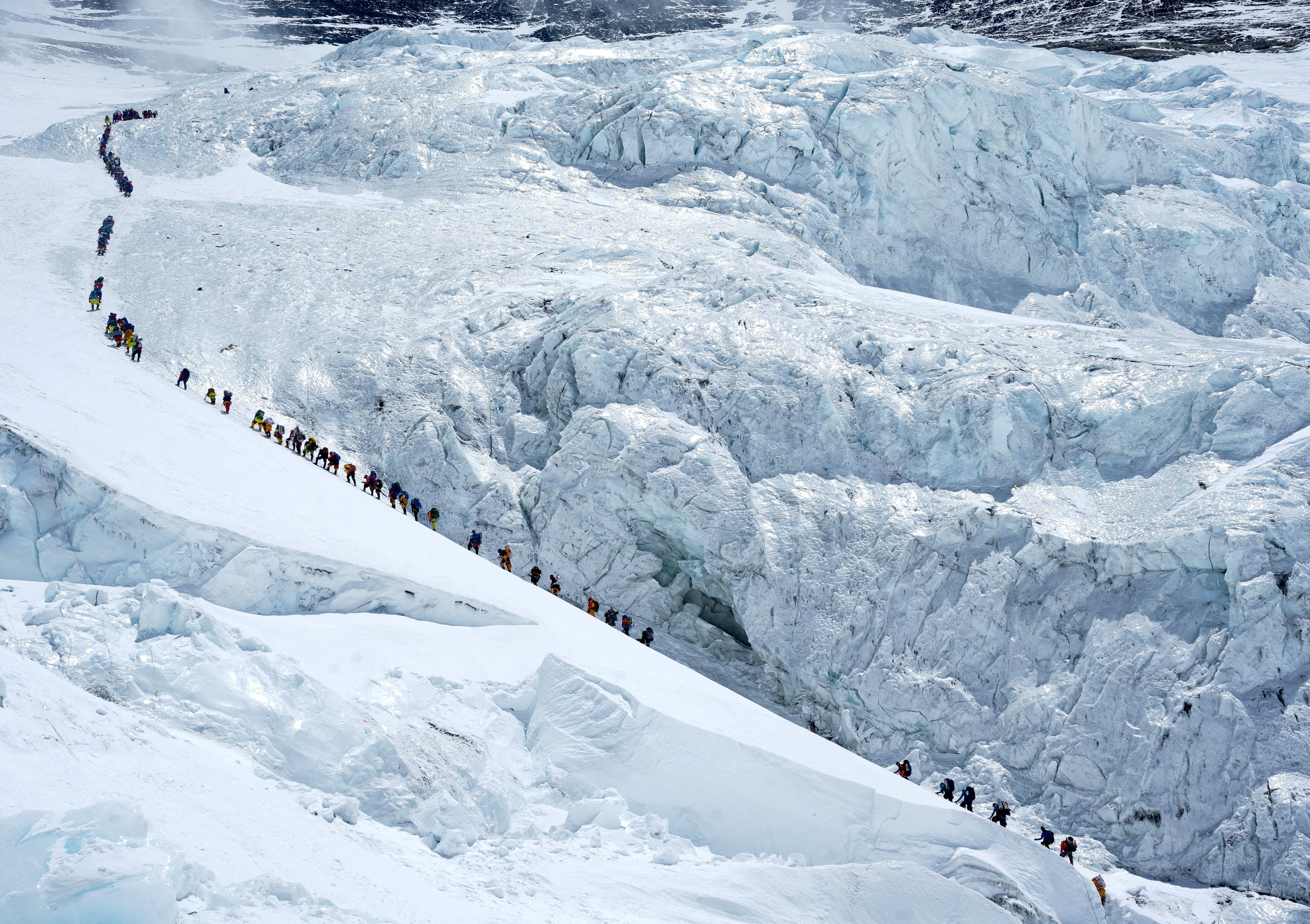 Hundreds of climbers make Mount Everest history as new summit record ...
