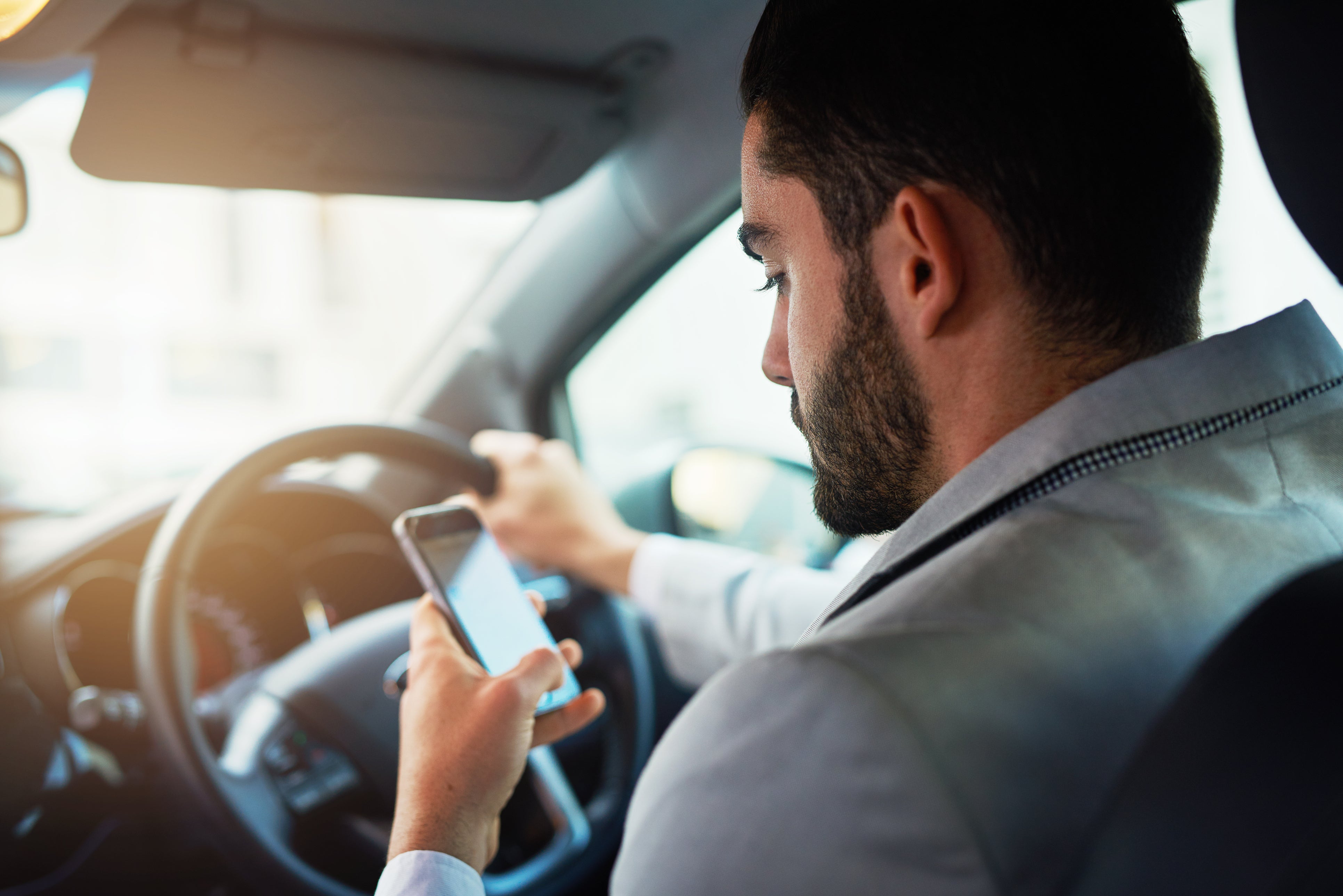 Illegal phone use behind the wheel surges among UK drivers | The ...