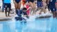 Moment Zohran Mamdani dives into pool in suit and tie | The Independent