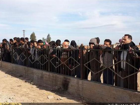 Isis militants publicly behead man for 'practicing sorcery' in Raqqa ...