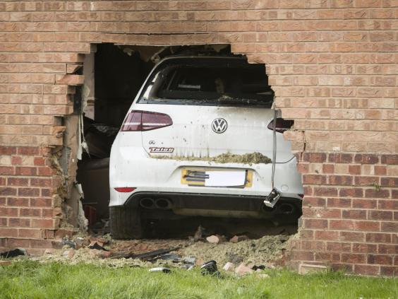 Souped-up VW Golf smashes straight through house wall into living room ...