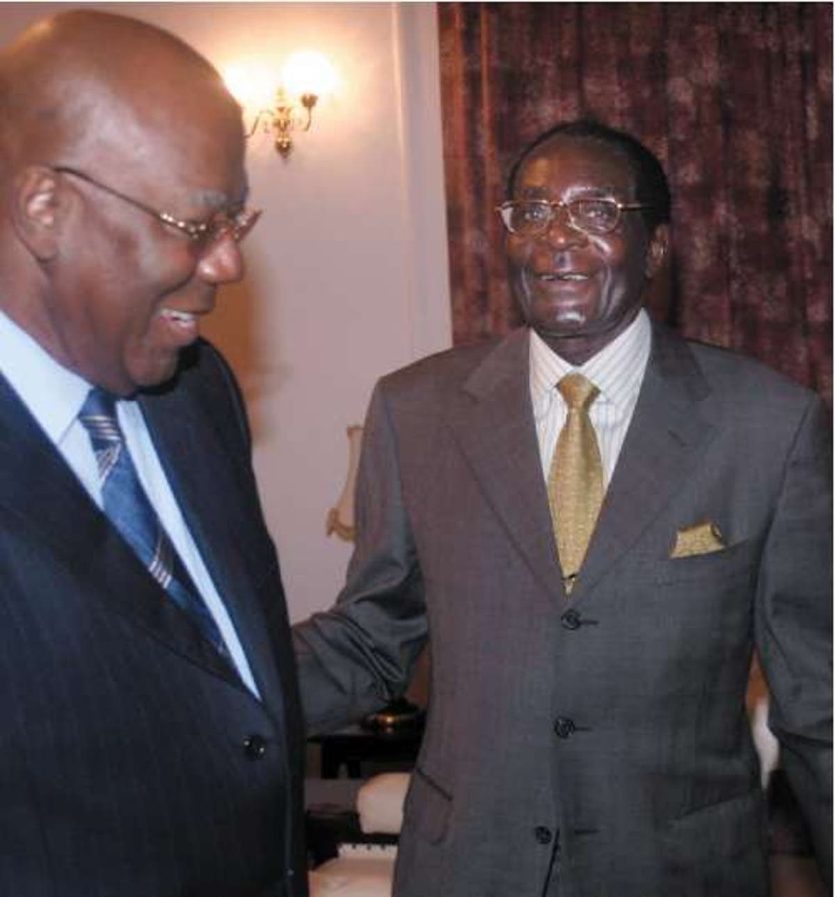 Mugabe's security men launch raids on opposition | The Independent ...