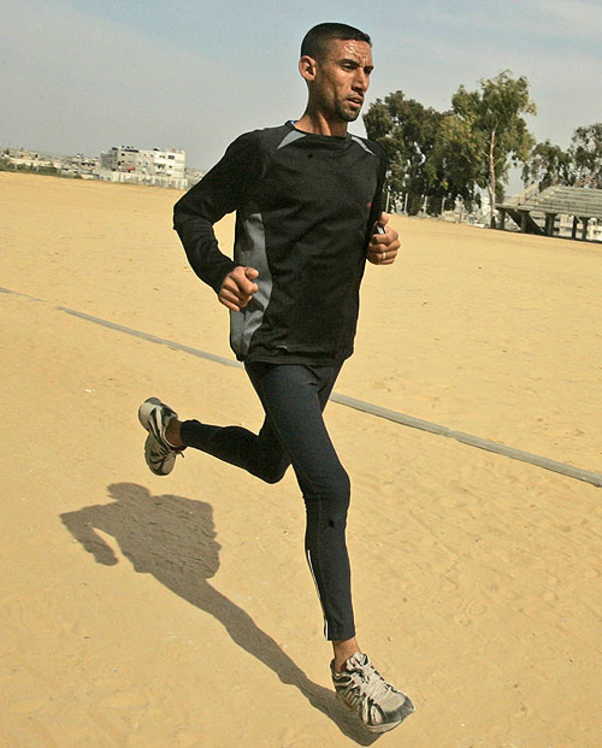 Training in a war zone: Gaza's running man | The Independent | The ...