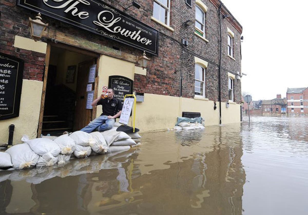 Two dead as flooding brings havoc across much of Britain | The ...