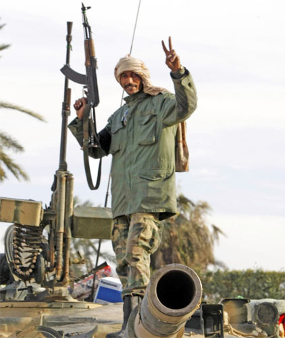 Battle for Libya shifts in desert sands as Gaddafi loyalists target ...