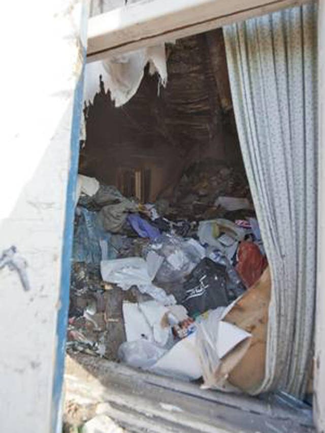 Hoarder was feared dead after living room ceiling collapsed under 20 ...