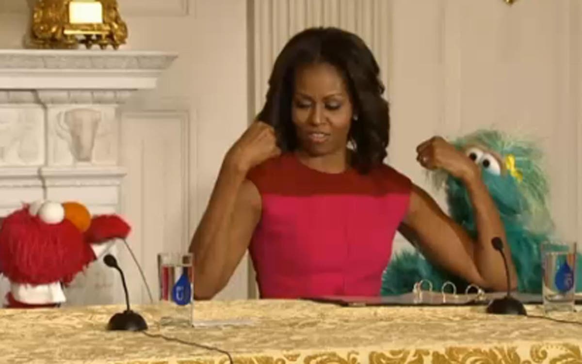 Video: Michelle Obama flexes her muscles with Sesame Street characters ...