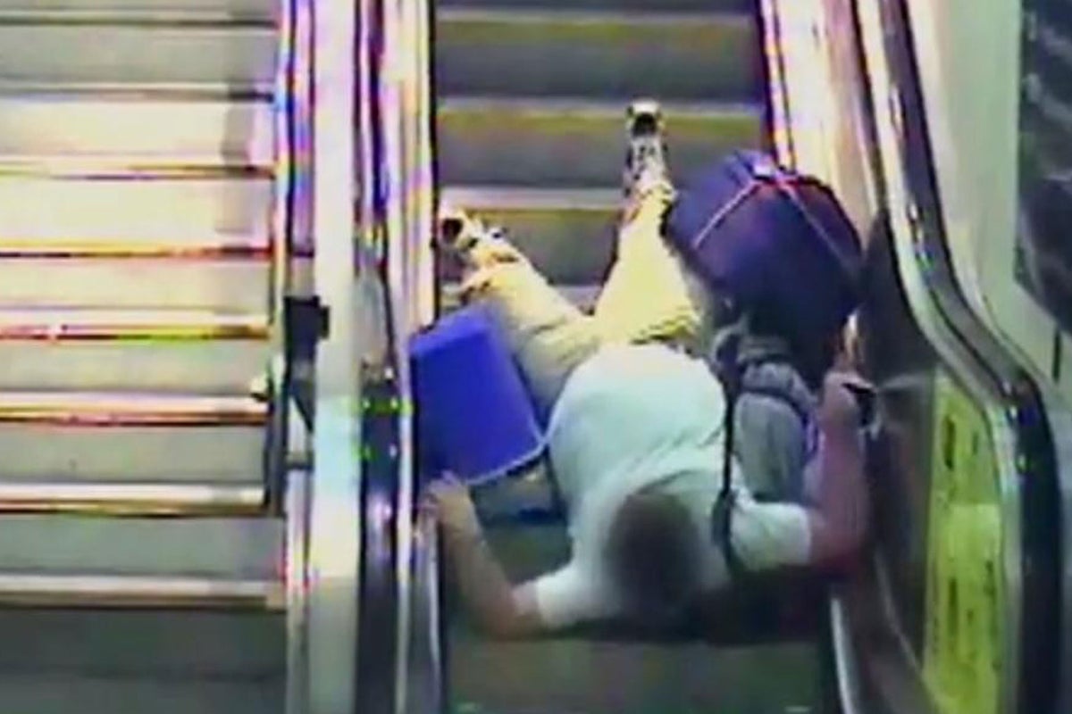 Escalator trips and falls caught on camera | The Independent | The ...