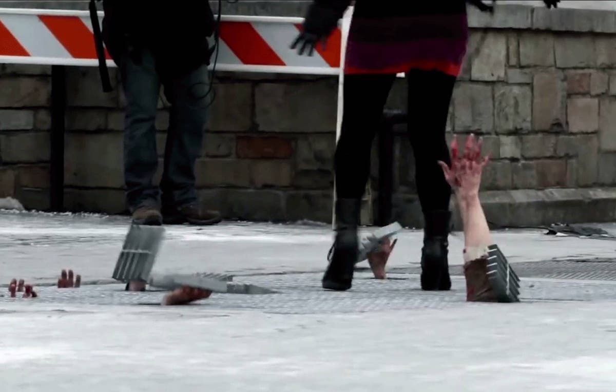 Terrifying zombie prank sees 'walkers' hiding in the grates of New York ...