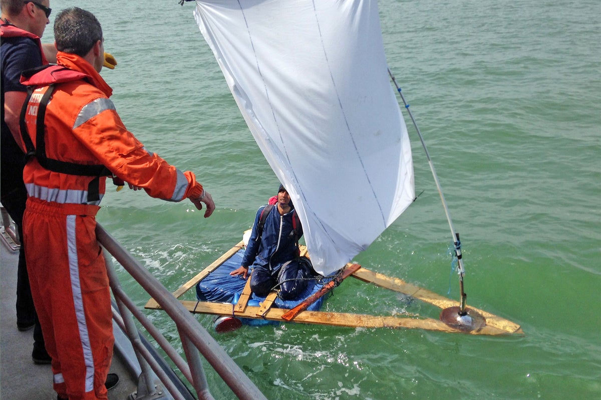 Desperate Afghan migrant rescued in the English Channel on wooden raft ...