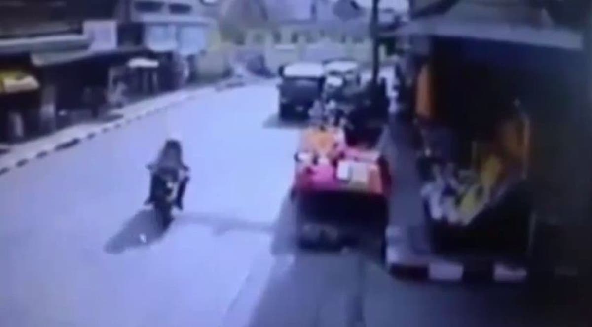 Motorcyclist in Thailand cheats death after riding past exploding ...