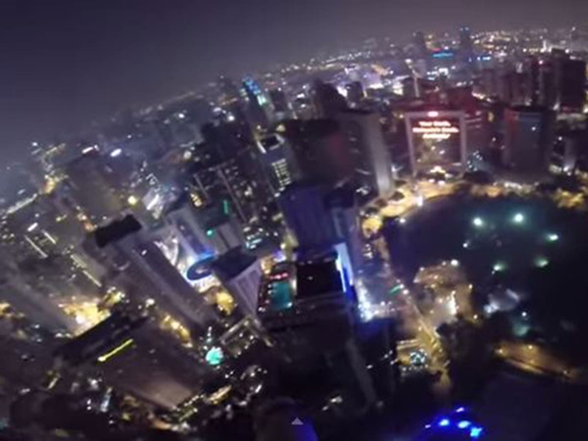 MUST WATCH: Man base jumps from 1,400ft tower into a swimming pool on ...