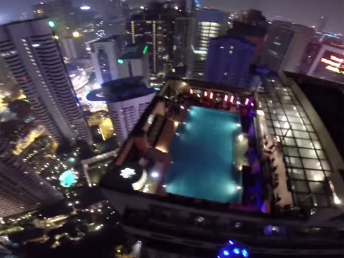 Video: Base jumper lands in swimming pool | The Independent | The ...