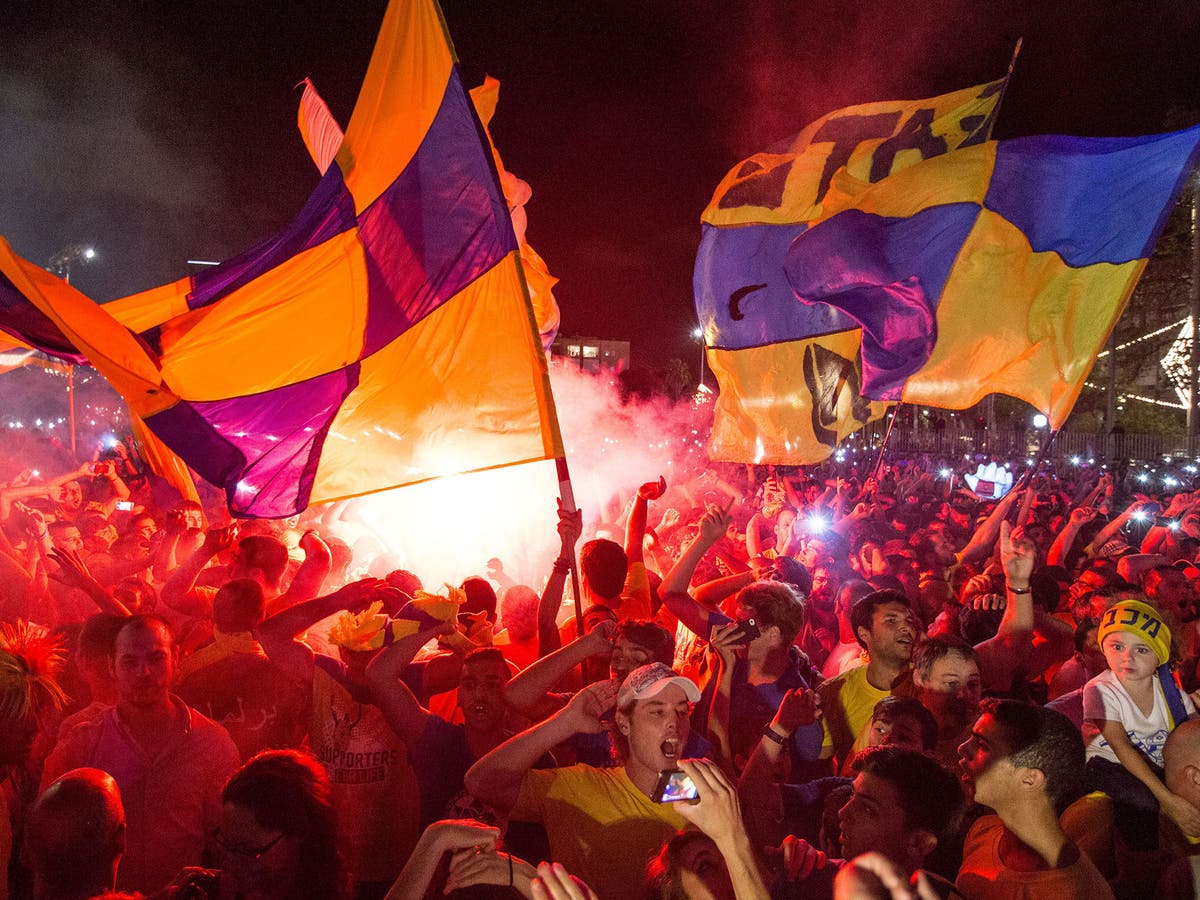 Rival fans clash outside a Tel Aviv courthouse that was extending ...