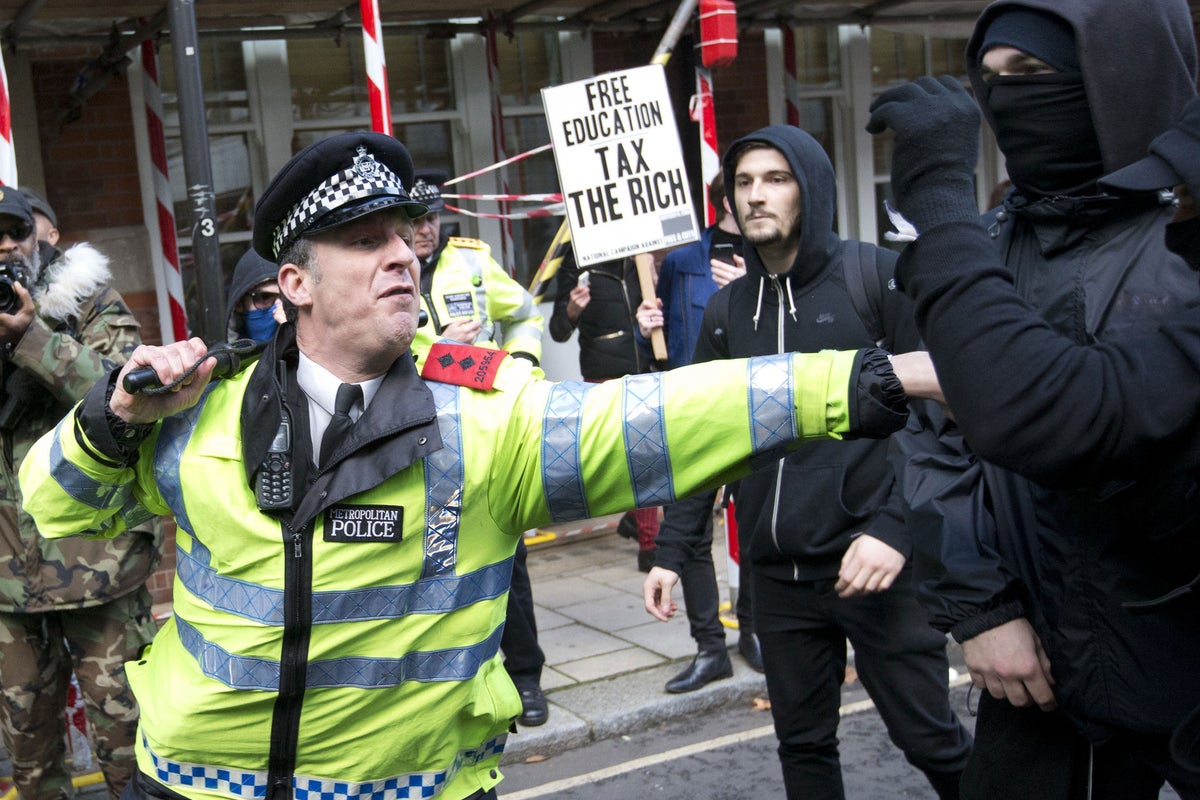 Students attempt to storm Tory party HQ but are thwarted by riot police ...