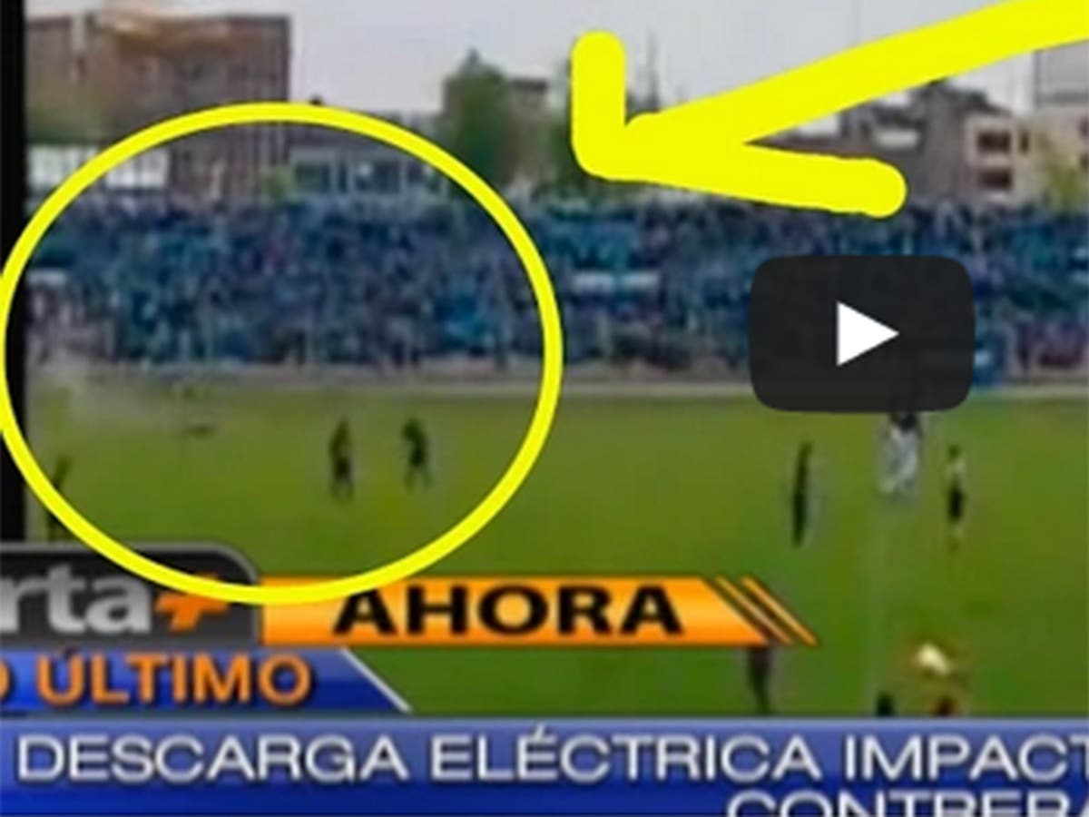 Video: Puff of smoke seen as footballer is struck by lightning during ...