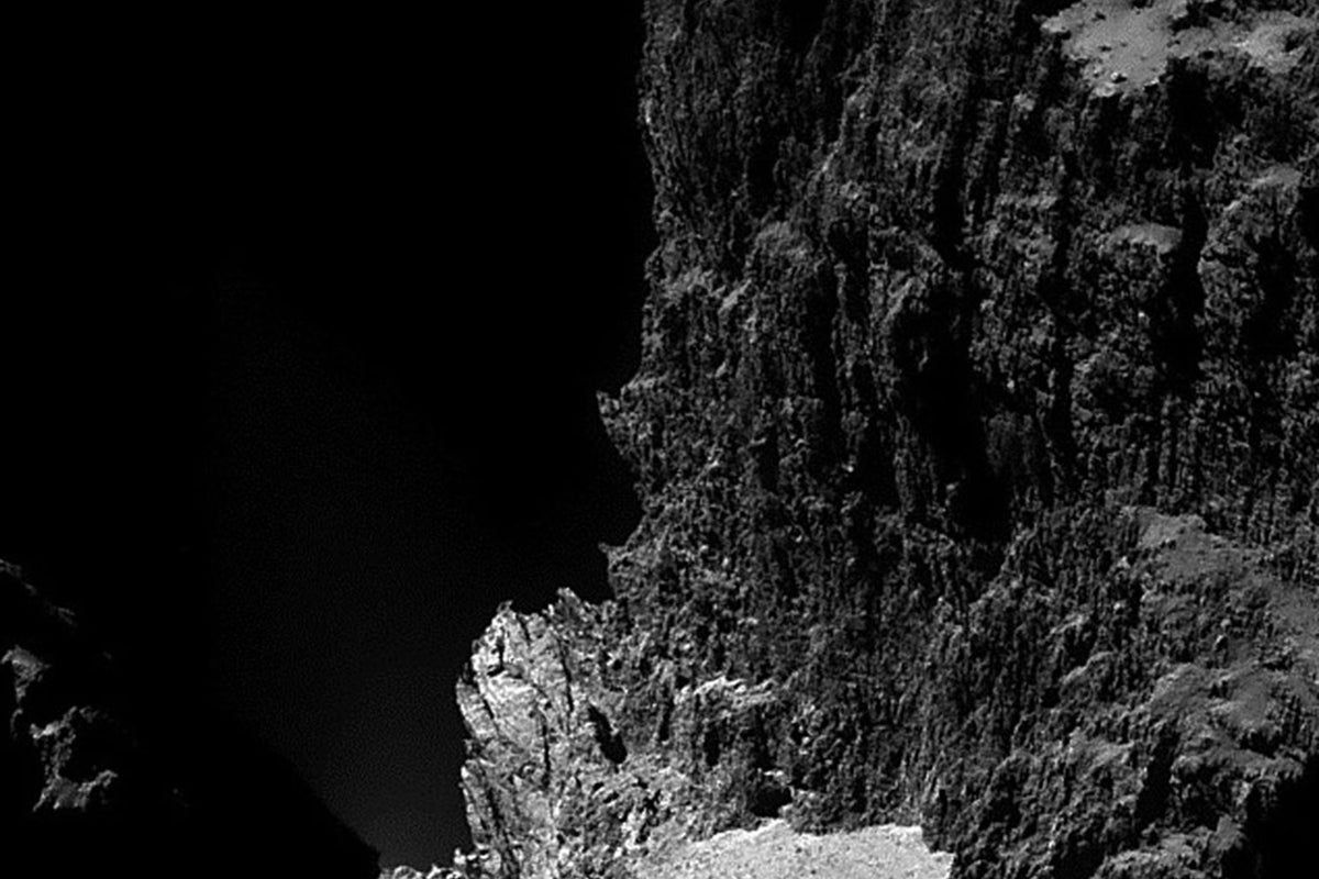 Rosetta captures steep one kilometre cliffs and boulder-strewn terrains ...