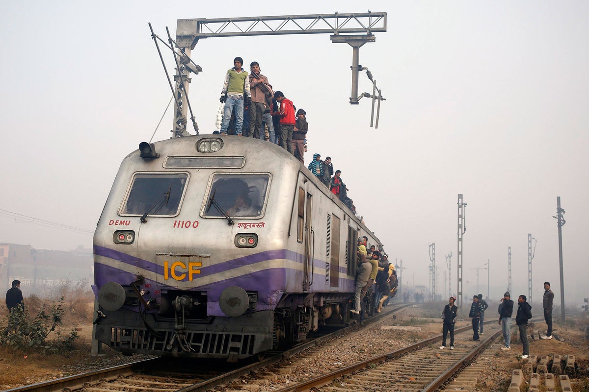Indian baby boy survives fall onto train tracks after mother gives ...