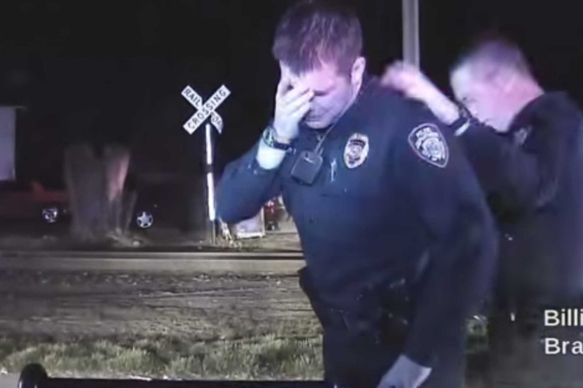 Video emerges of distraught US policeman just moments after he shoots ...
