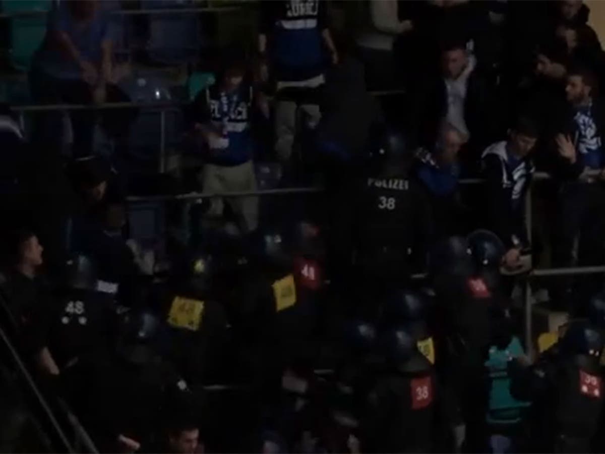 Video: Seven injured as football fans clash with police at indoor ...