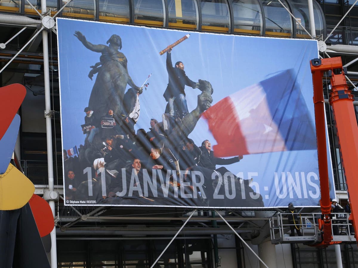 Charlie Hebdo march photograph draped over the Pompidou Centre in Paris ...