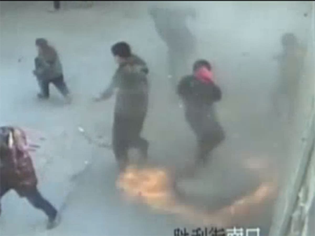 Exploding manhole cover knocks boy to the ground after he drops lit ...