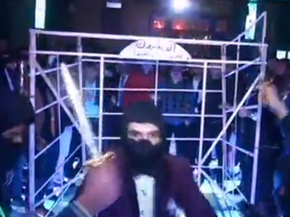 'Isis-themed wedding' sees couple hold first dance in a cage surrounded ...