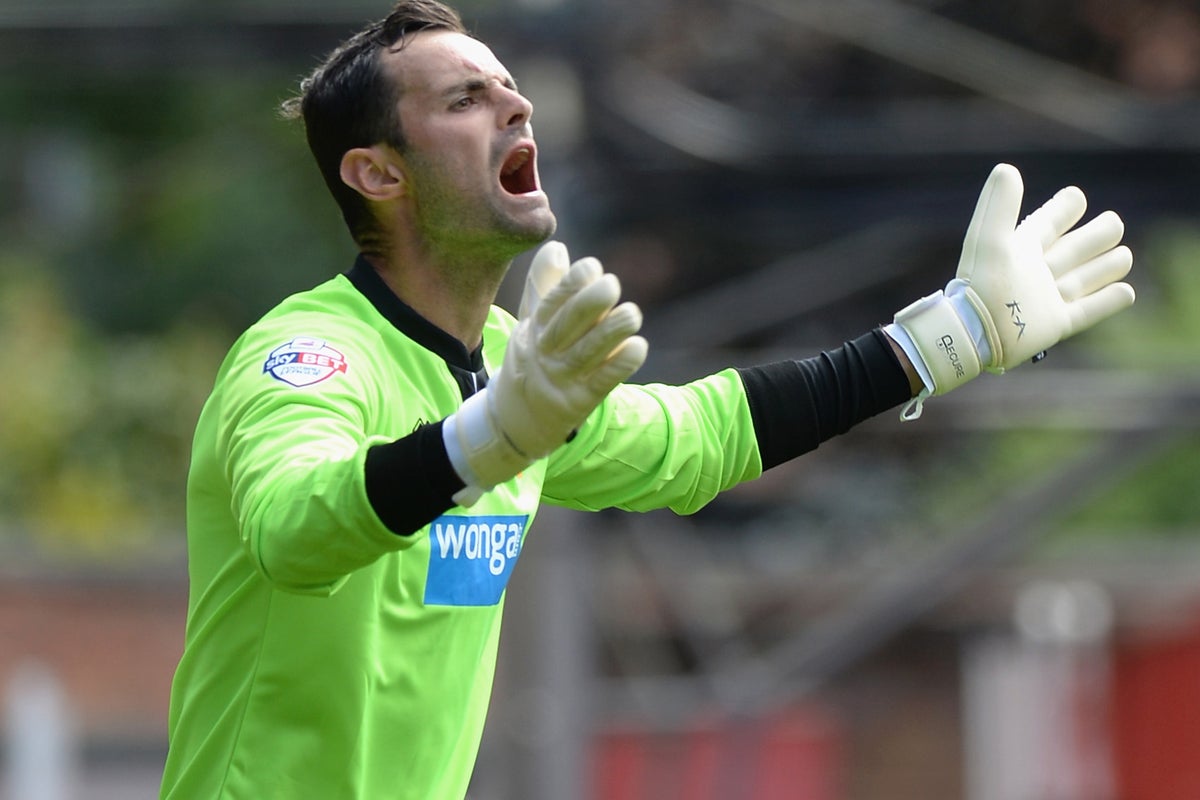 Blackpool goalkeeper Joe Lewis forced to wear 'autographed' shirt for ...