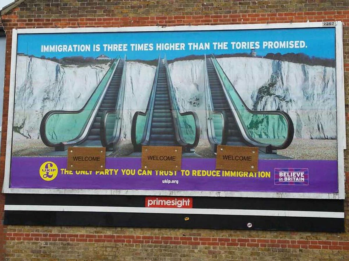 Protester adds welcome mats to Ukip immigration poster in Nigel Farage ...