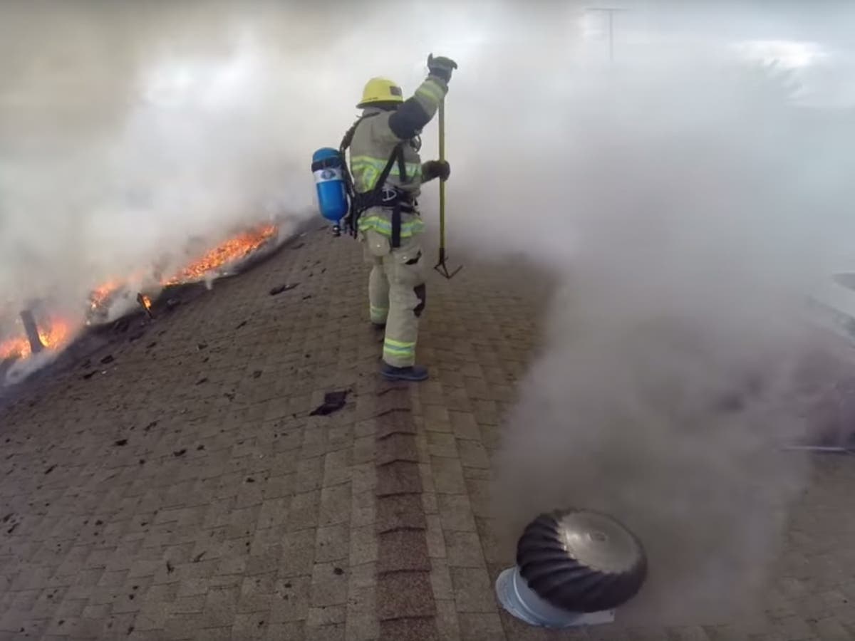 GoPro strapped to fire fighter's helmet shows rescuers tackling house ...