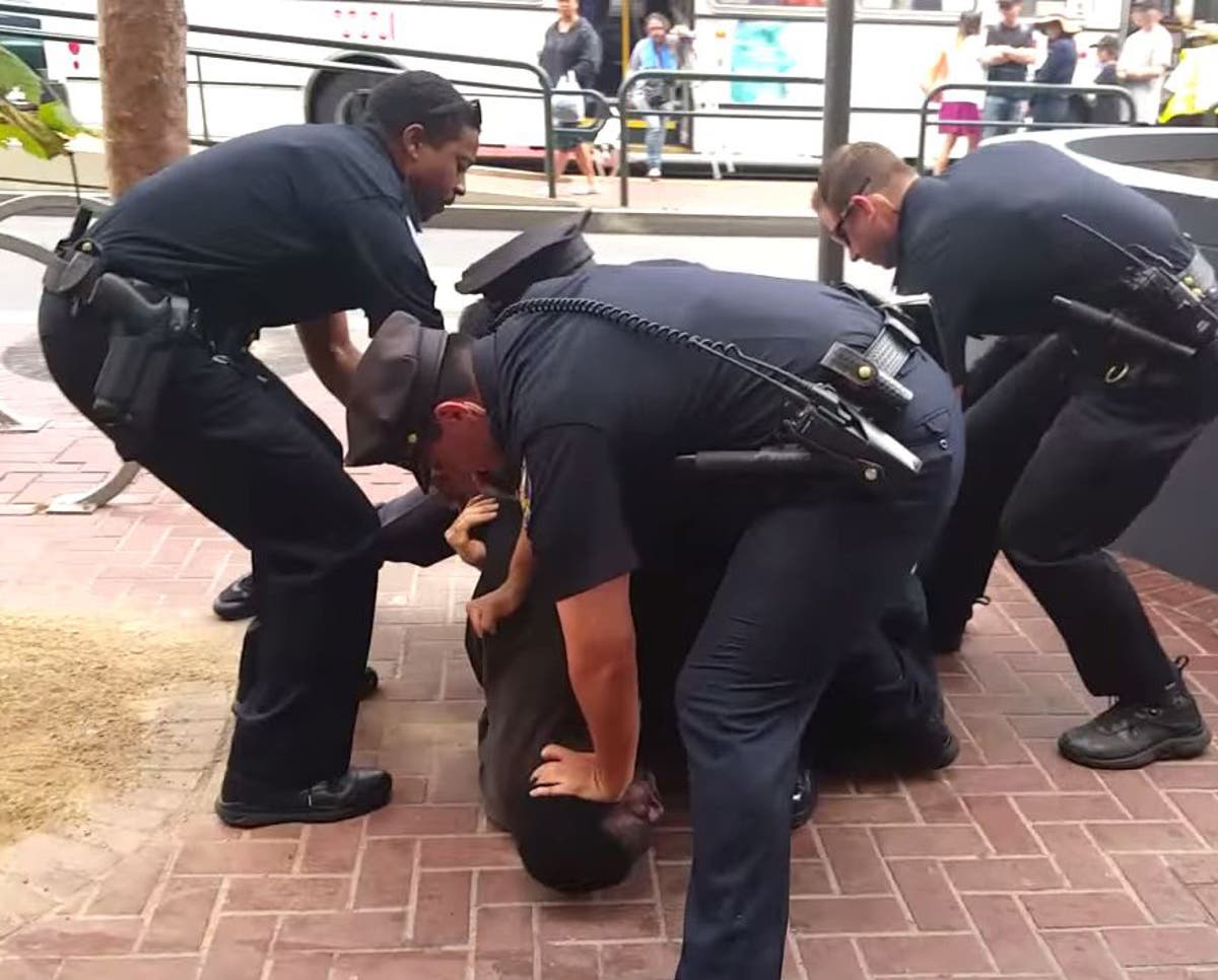 One-legged black man pinned to the ground and handcuffed by US police officers | The Independent ...