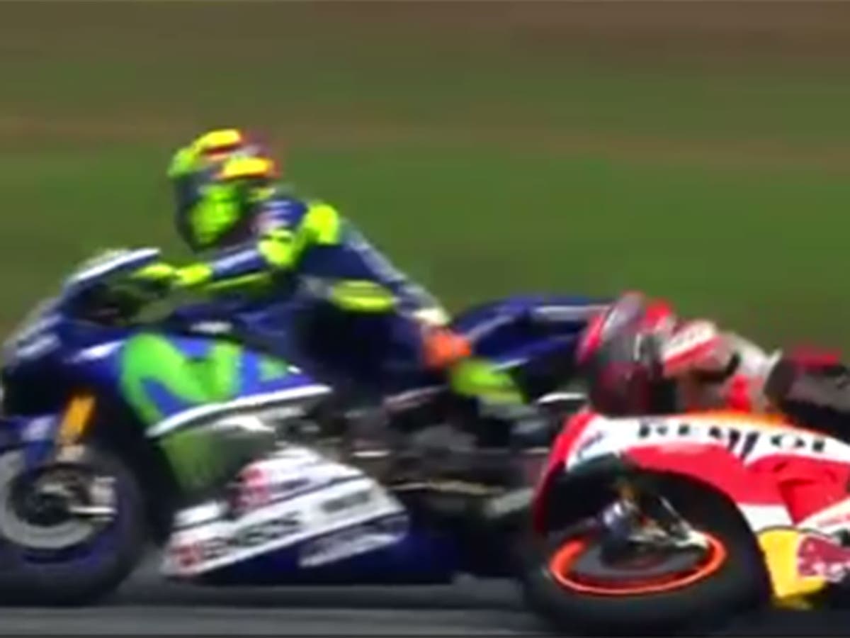 Valentino Rossi 'kicks' Marc Marquez from bike causing crash at MotoGP ...