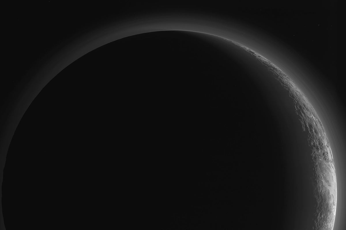 Pluto’s stunning, hazy crescent captured in images from New Horizons ...