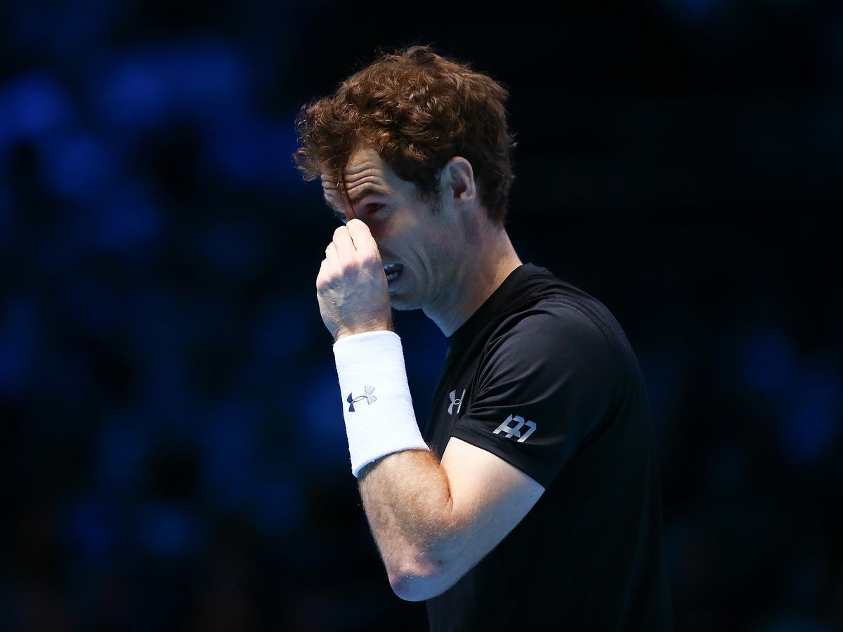 Andy Murray cuts his hair during ATP Tour Finals match against Rafa ...
