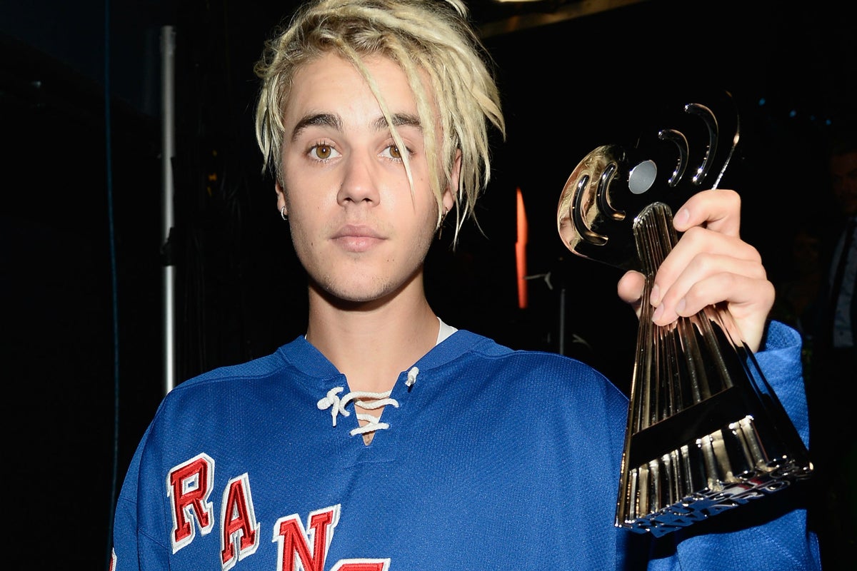 Justin Bieber condemned by PETA for posing with captive tiger at a ...