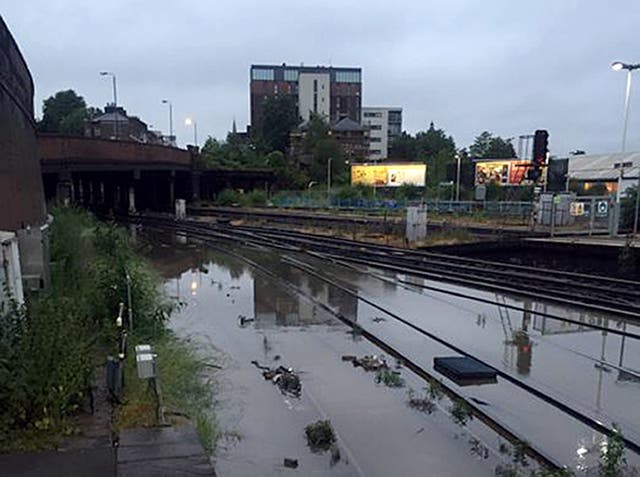 UK weather: London and South East hit by flash flooding – in pictures ...