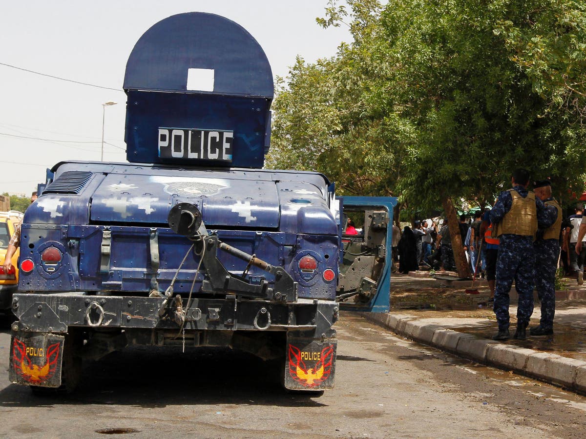 Isis suicide bomber kills at least 20 people at security checkpoint in ...