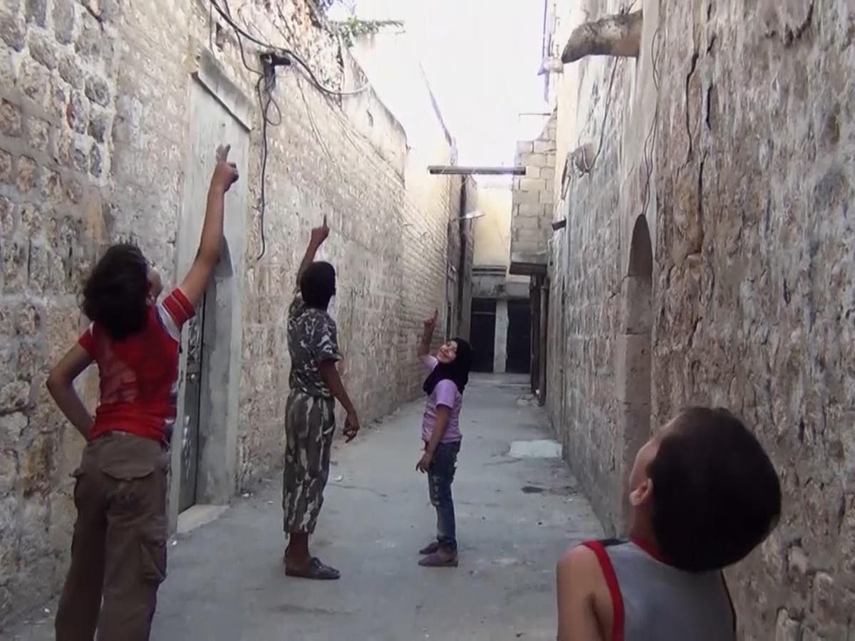 Syrian war: Children play games in the streets of Aleppo while bombs ...