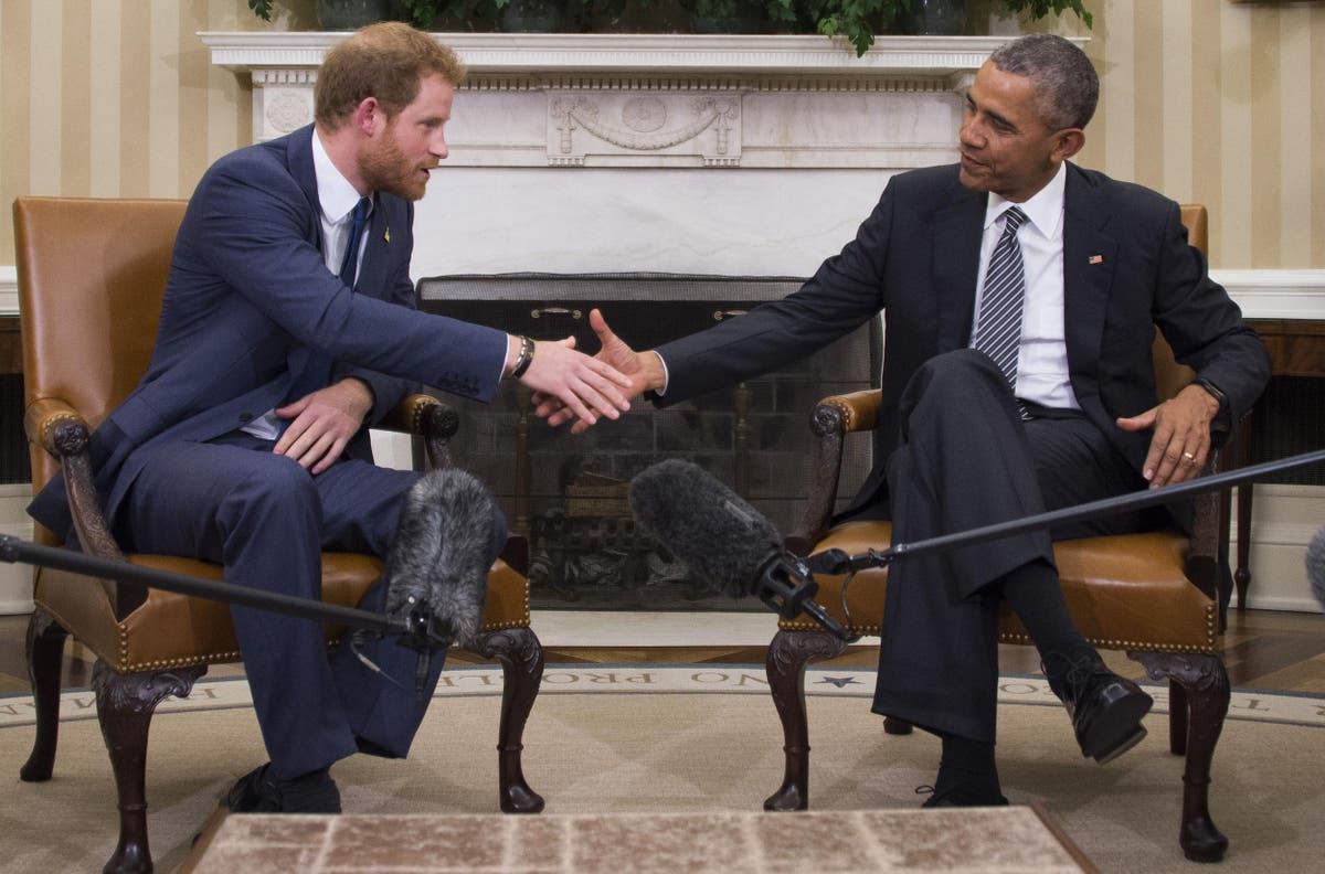 Prince Harry gave Barack and Michelle Obama a signed photograph of ...