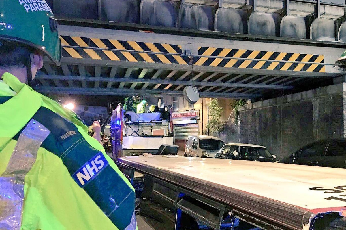 Roof ripped off double-decker bus as 26 injured in Tottenham bridge ...