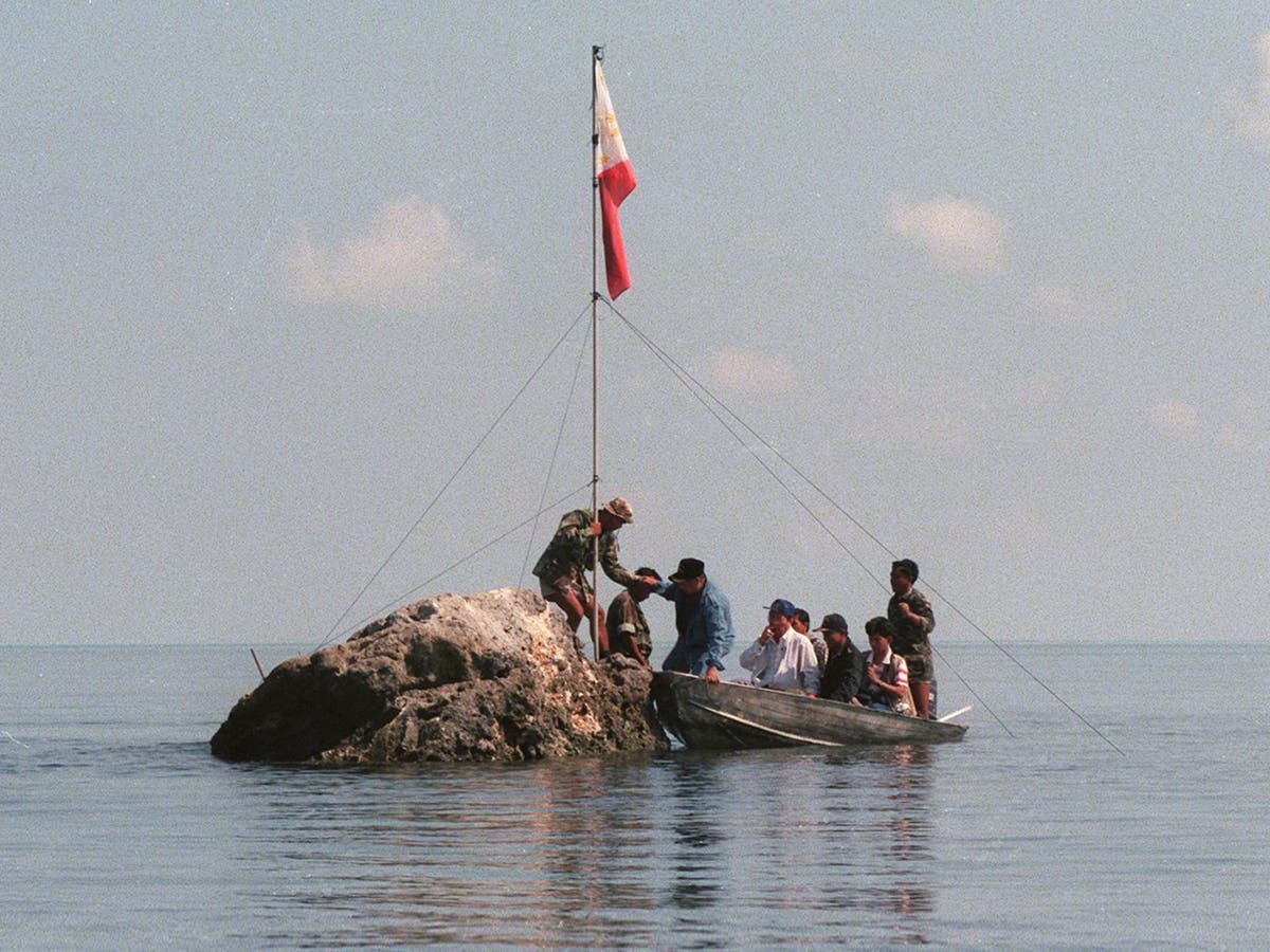 China to build on disputed shoal in South China Sea | The Independent ...